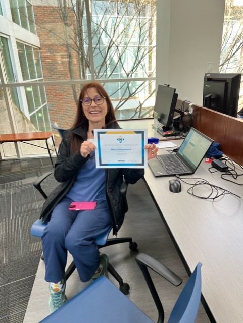 Mary earns computer skills certificate with help from staff member ...